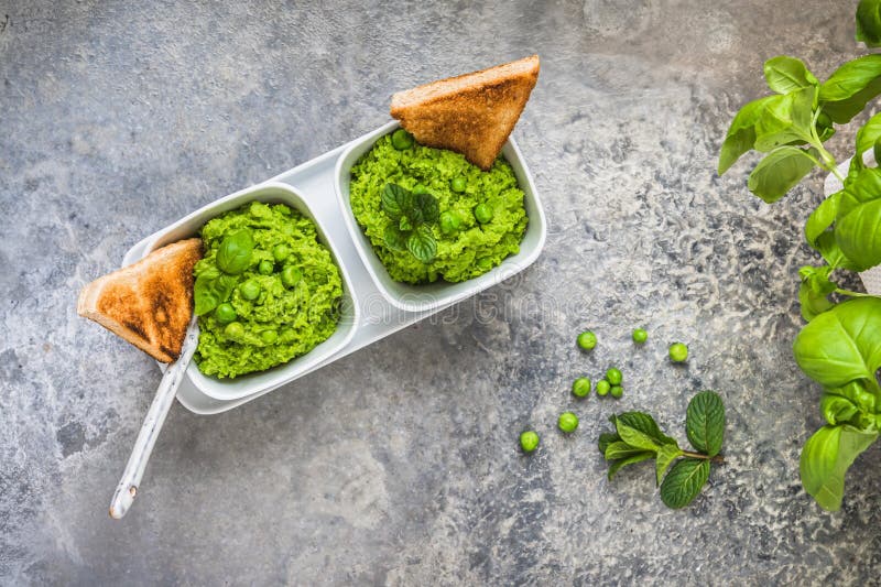 Pea Puree with Basil and Roasted Bread on Rustic Gray Background Stock ...