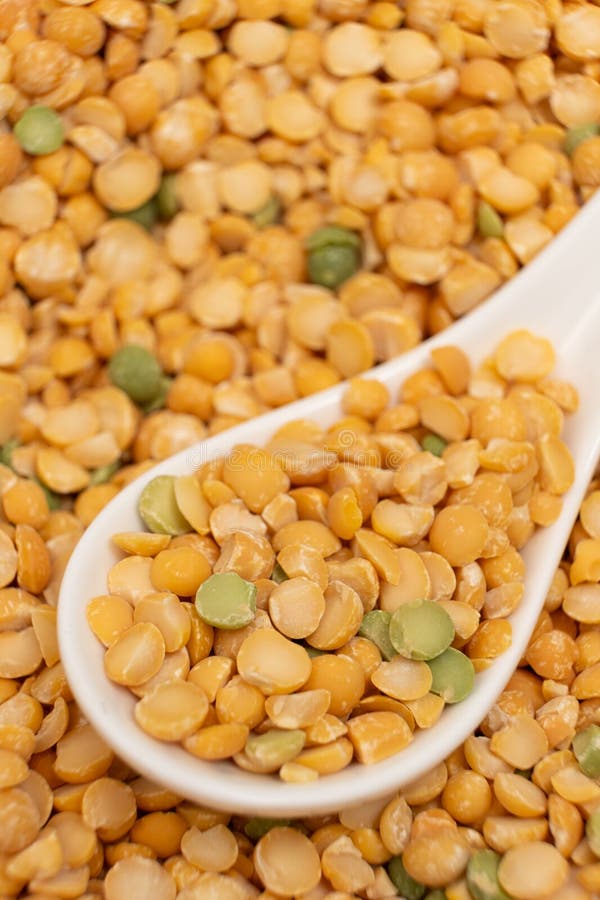 Pea Yellow Groats Grains Cereal in Spoon Close-up Macro. Stock Photo ...
