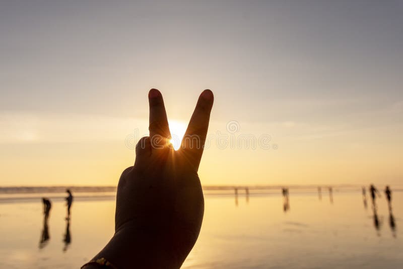 Peace sign at sunset stock image. Image of idea, happy - 225942641