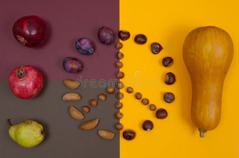 Peace Symbol of Nuts and Autumn Fruits on Split Background Stock Image ...