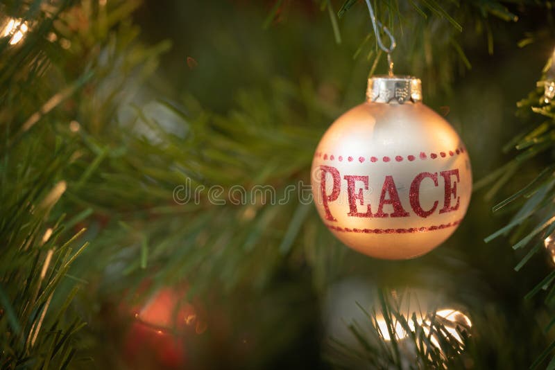 Peace Written on Christmas Ornament Hanging on Tree Stock Image - Image ...
