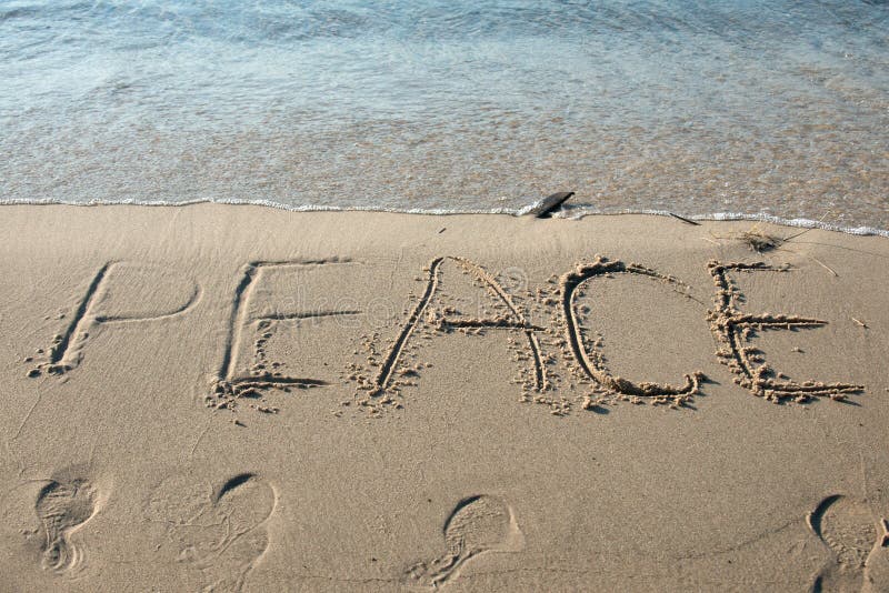 Peace written in the sand stock image. Image of letter - 78881245