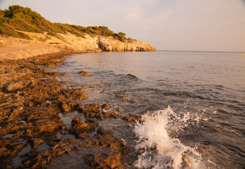 Peaceful Beach with Rocks during Summer in Santo Tomas in Menorca Stock ...