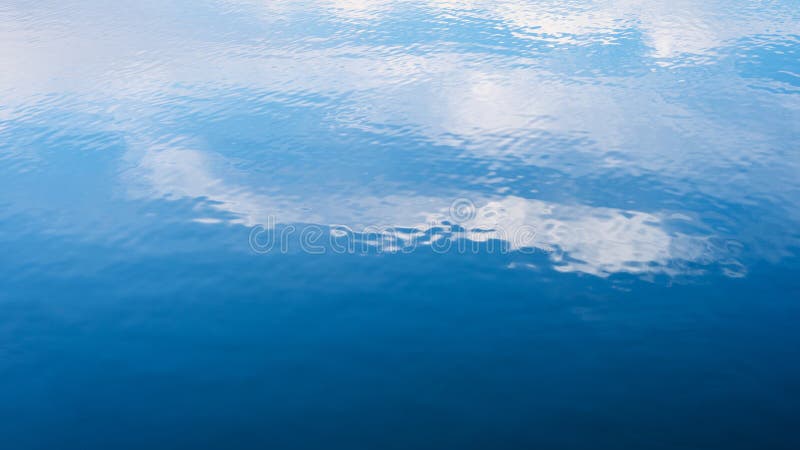 Peaceful Blue Water Surface with White Clouds Reflections, Nature ...