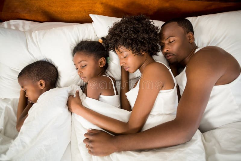 Peaceful family sleeping stock image. Image of bedroom - 65329779