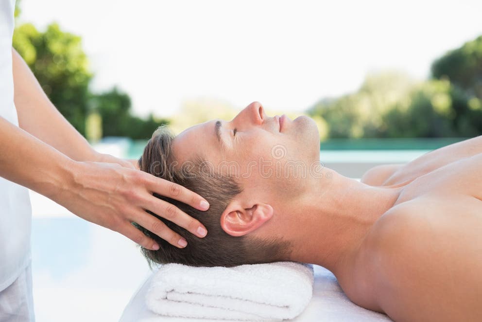 Peaceful Man Getting a Head Massage Poolside Stock Photo - Image of ...