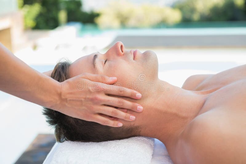 Peaceful Man Getting a Head Massage Poolside Stock Image - Image of ...