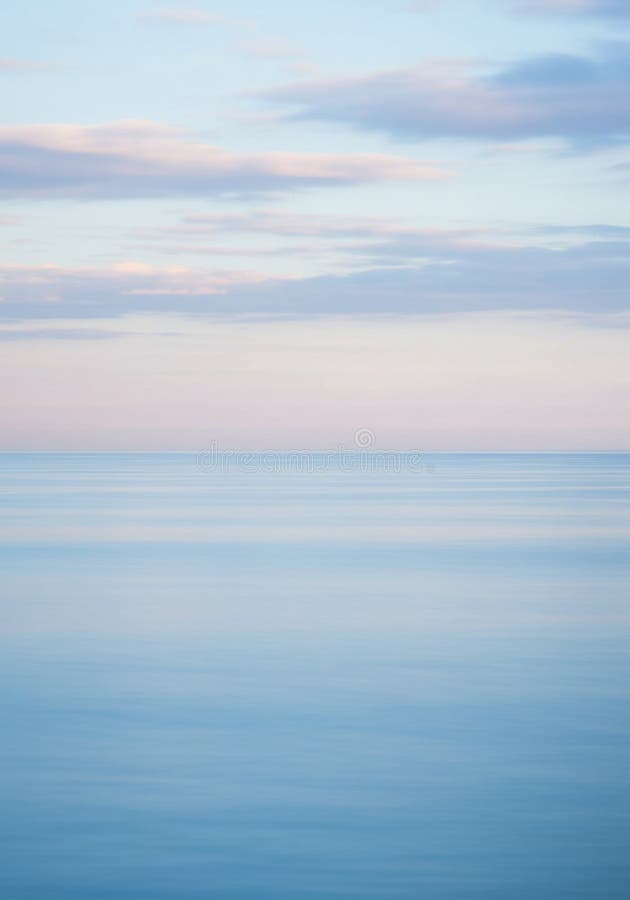 Peaceful Ocean Horizon at Dawn Pastel Sky and Calm Water Stock ...