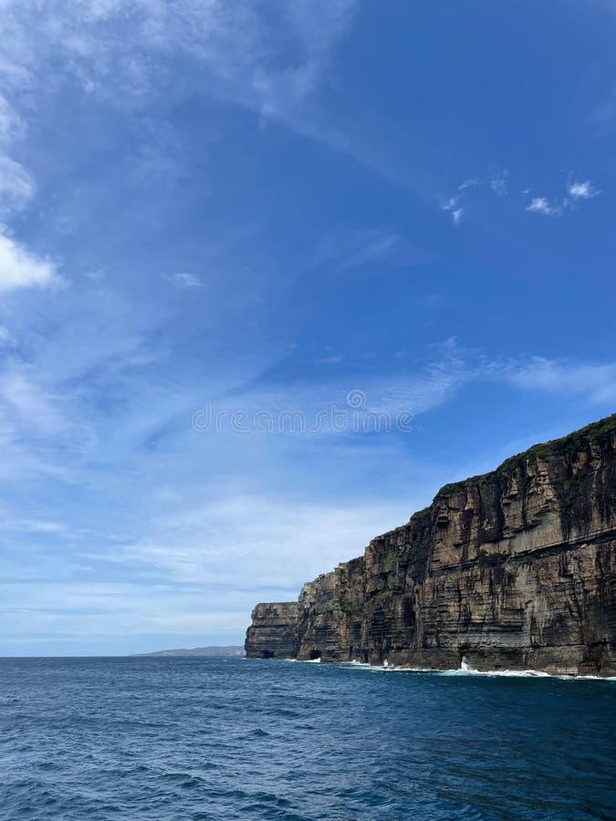Peaceful Ocean Meeting a Perpendicular Cliff Stock Photo - Image of ...