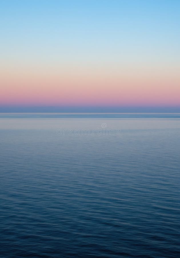 Peaceful Ocean Sunset with Pink and Blue Gradient Sky Stock ...