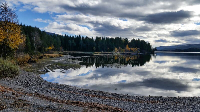 Peaceful and Quiet Scenery of Lake with Dramatic Clouds Reflected in ...