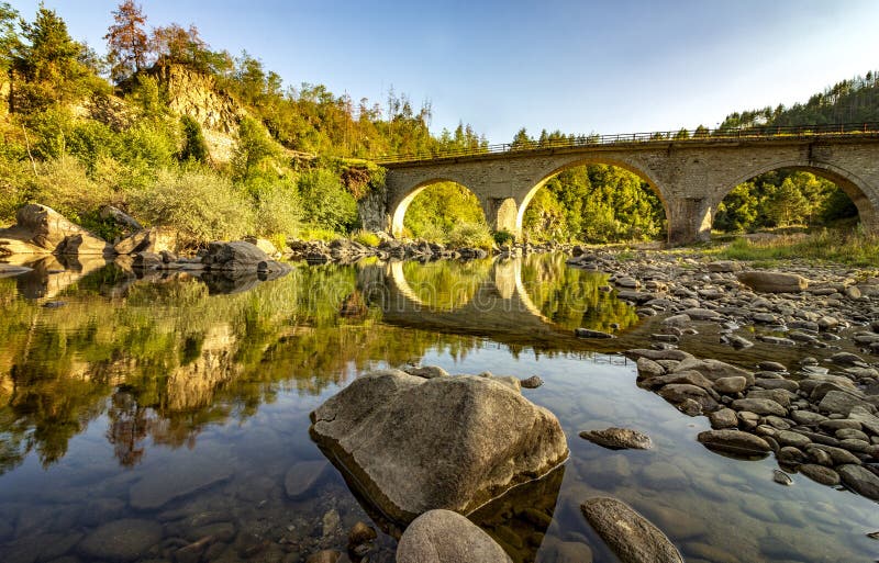 Peaceful River with Water Reflection and Old Stone Bridge Stock Image ...