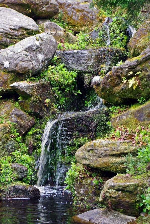 Peaceful Small Rock Waterfall Stock Photo - Image of running, calm ...