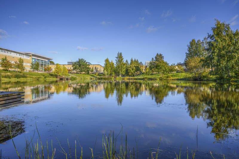 Peaceful Tranquill View of a Lake Side Reflection of Trees and Building ...