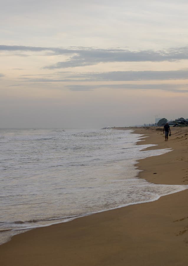 Peaceful walk at beach editorial photography. Image of peaceful - 130834512