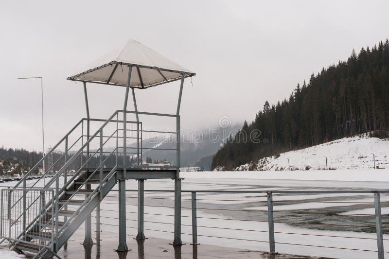 Peaceful Winter Scenery Featuring a Stilted Observation Platform by a ...