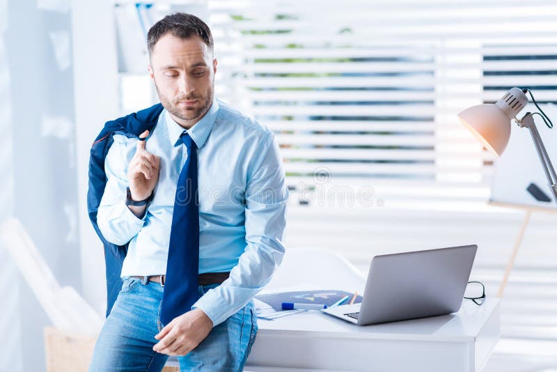 Peaceful Young Worker Sitting on a Table and Looking Bored Stock Image ...