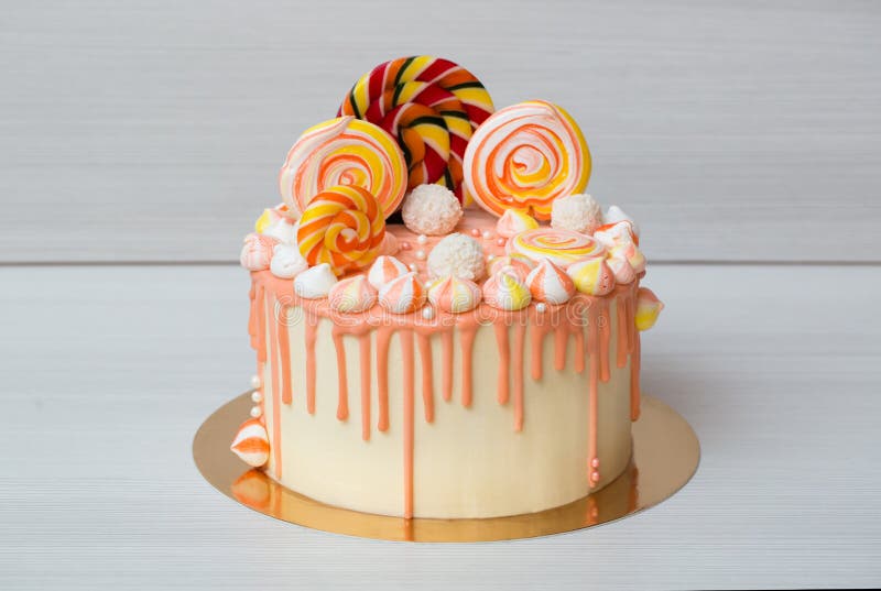 Peach Colored Cake with Meringue and Candy for a Child`s Birthday ...