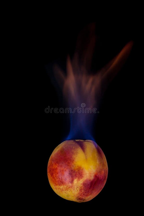 Peach on fire stock photo. Image of black, background - 57949504