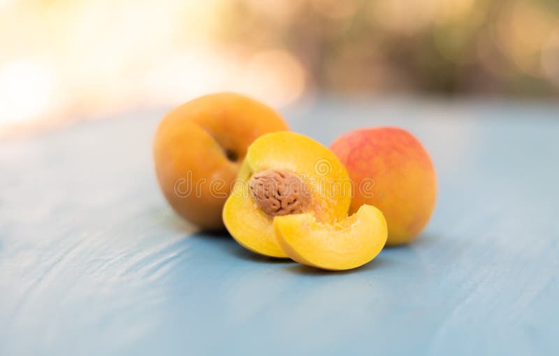 Peach fruit on wood table stock image. Image of place - 181635305