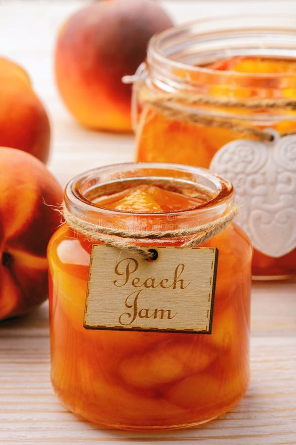 Peach Jam in Glass Jars on White Wooden Background. Stock Image - Image ...