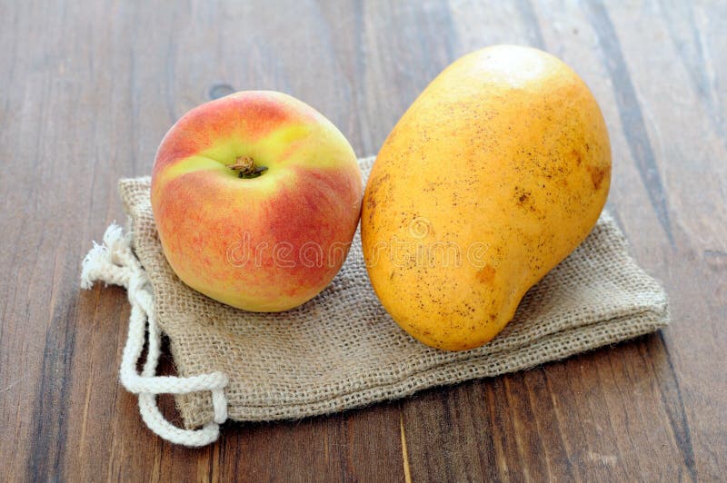 Peach and mango stock image. Image of rustic, fruit, tasty - 77664857