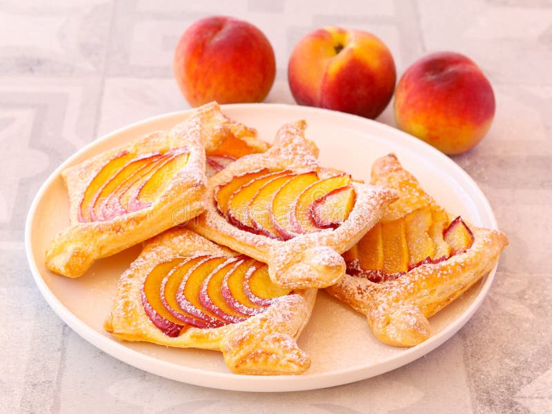 Peach puff pastry cakes stock photo. Image of icing - 326204802