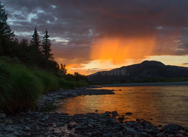 Peach rain at sunset stock photo. Image of stream, trees - 33550342