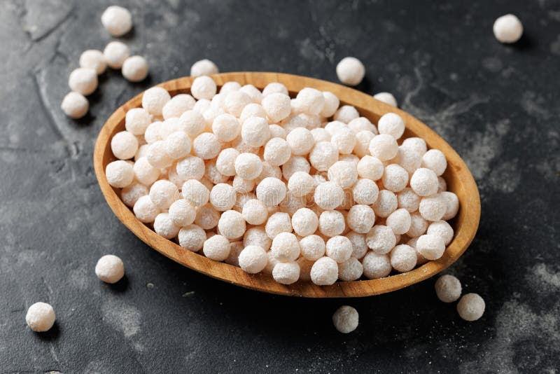 Peach Uncooked Tapioca Pearls in Wooden Bowl Stock Image - Image of ...