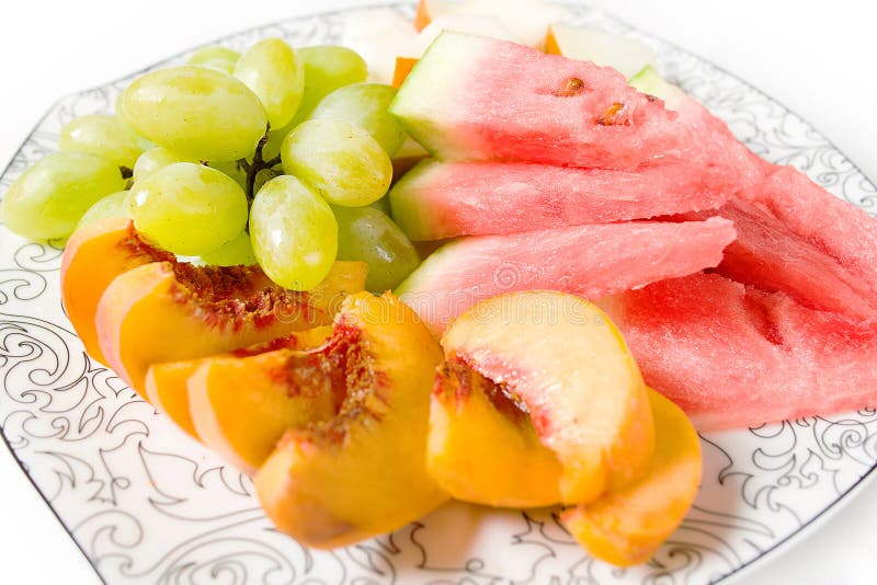 Peach, White Grape, Watermelon and Melon on the Plate Stock Photo ...