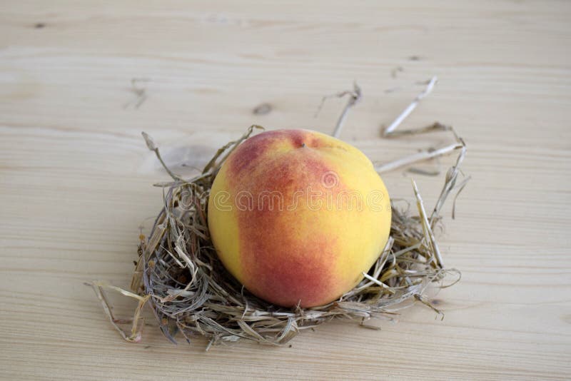 The Peach is on a Wooden Table. Fruit is Large, Yellow, Fresh, Ripened ...