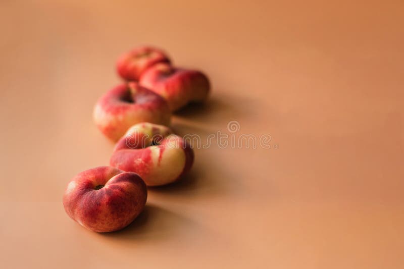 Peaches Donuts Lie in a Row on a Peach Background, Perspective View ...