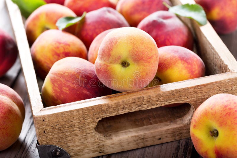 Peaches in a wooden box stock image. Image of group, life - 85095547