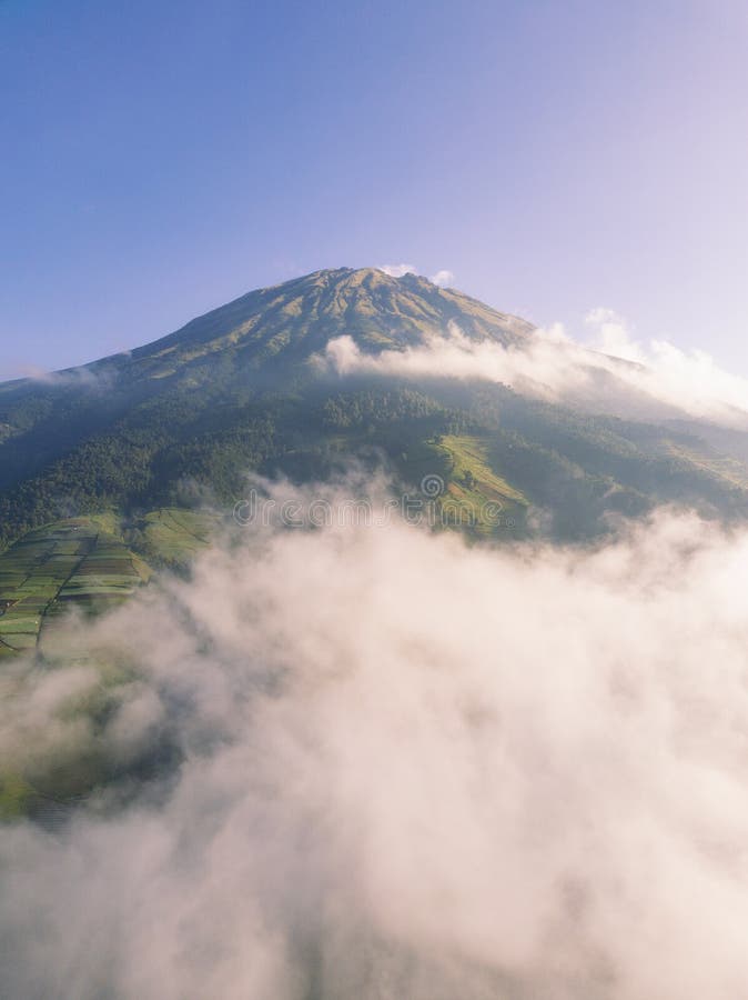 The Peak of the Mount Sumbing Stock Image - Image of reflection, cloud ...