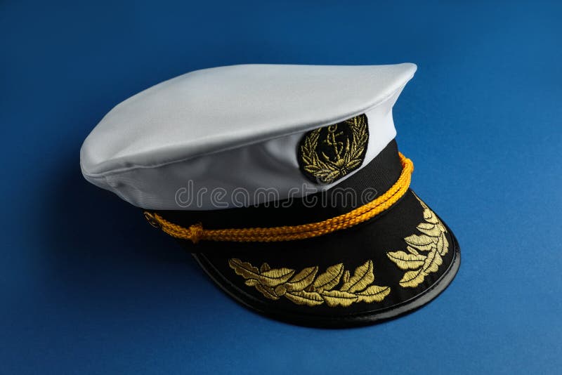 Peaked Cap with Accessories on Blue Background Stock Image - Image of ...