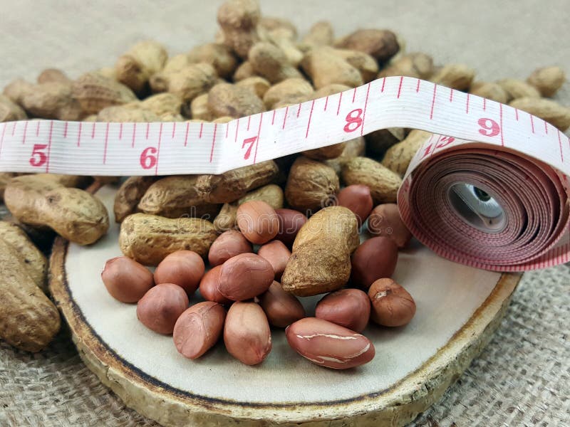 Peanut Or Groundnut On A Wood Plate With Measuring Tape. Stock Photo ...