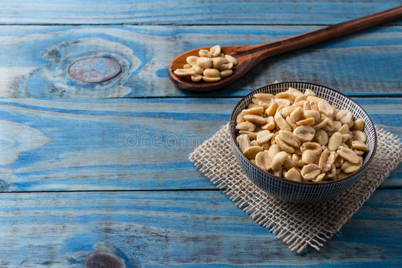 Peanut Inside Ceramic Pot Over Blue Pine Wood Stock Image - Image of ...