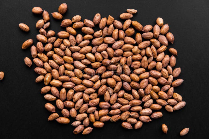 Peanut Nuts Scattered on a Black Table. Peanuts Nut is a Healthy ...