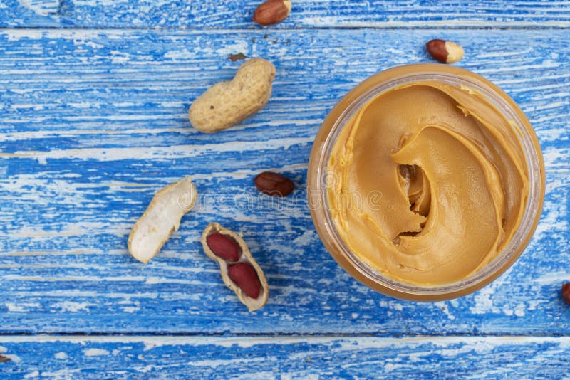 Peanut Paste in an Open Jar and Peanuts in the Peel Stock Image - Image ...