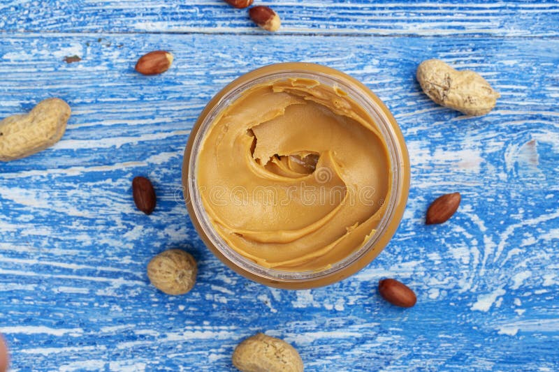 Peanut Paste in an Open Jar and Peanuts in the Peel Stock Photo - Image ...