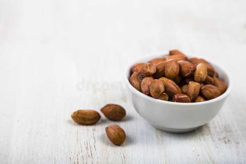 Peanut in a Plate on a Wooden Table. Stock Image - Image of nature ...
