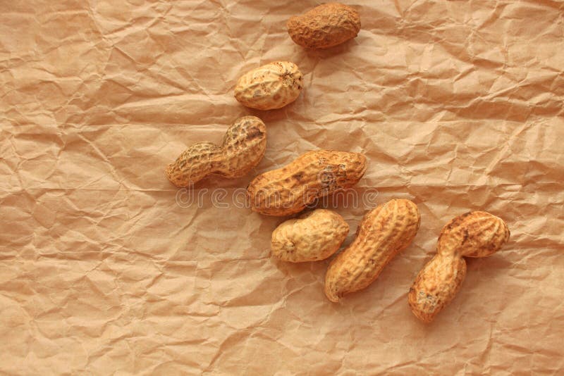 Peanut in a Shell on Kraft Paper, Food Background of Peanuts Stock ...