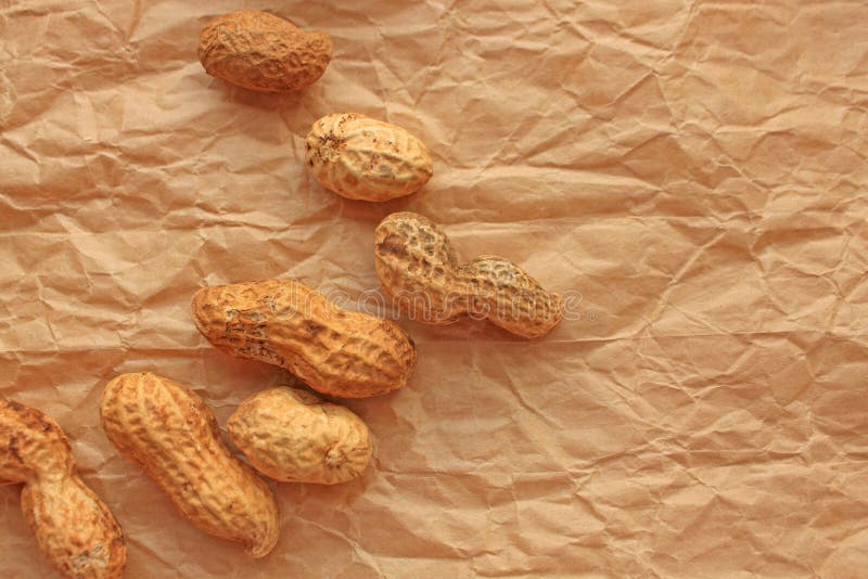 Peanut in a Shell on Kraft Paper, Food Background of Peanuts Stock ...
