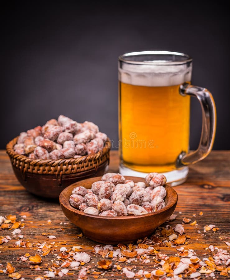 Beer and salted peanuts stock image. Image of salted - 70875919