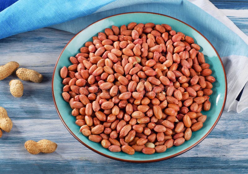 Peanuts on a Blue Wooden Table . Stock Image - Image of healthy, white ...