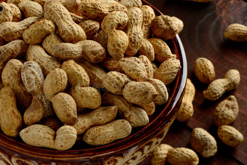 Peanuts In A Bowl On A Dark Background. Peanuts In A Shell. Healthy ...