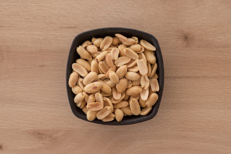 Peanuts in a container stock image. Image of black, peanuts - 195838811