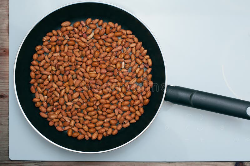 Peanuts in a Frying Pan on the Kitchen Board Stock Image - Image of ...