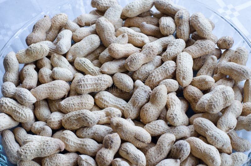 Peanuts in group on table stock image. Image of glass - 137599601