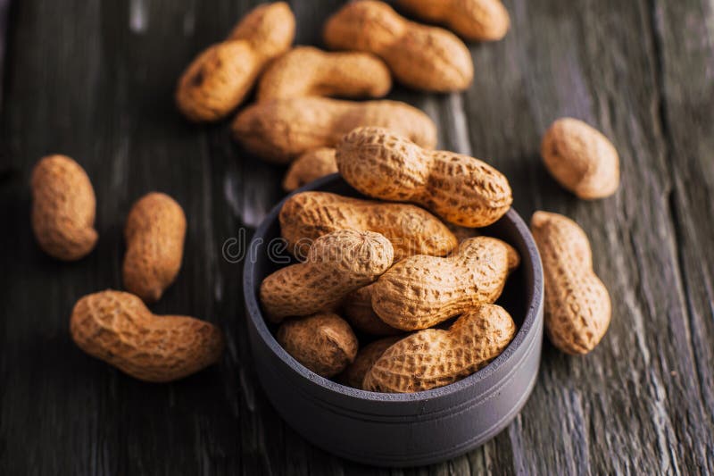 Peanuts in Nutshell on a Piece of Wood Stock Image - Image of health ...